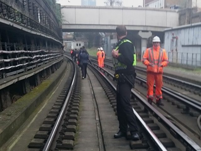 Hundreds of rail passengers forced to walk along tracks after power ...