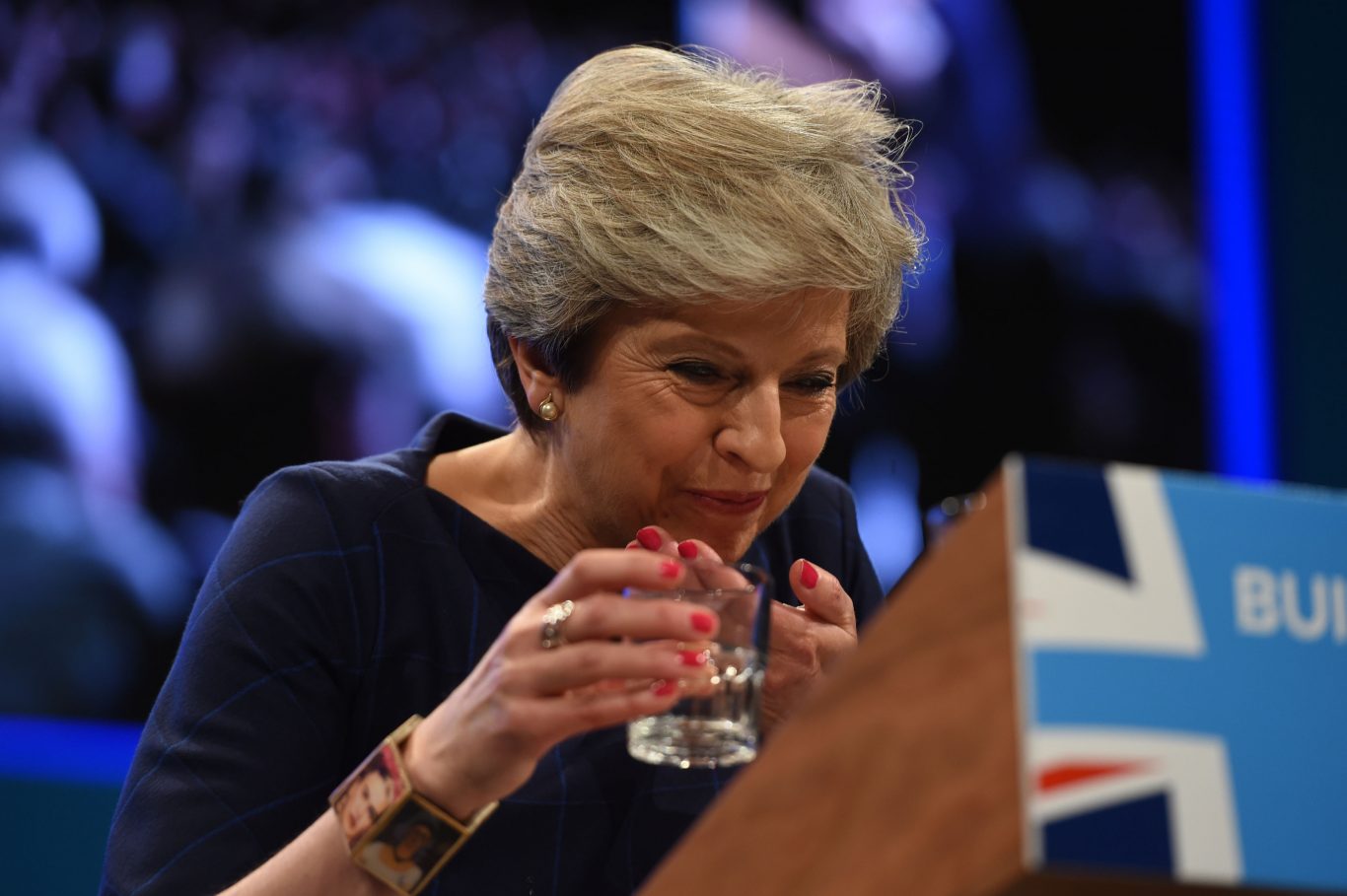 May makes light of keynote speech cough with medicine-themed tweet ...
