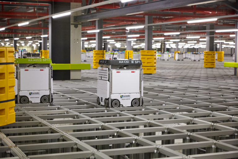 See the Ocado robots whizz around their automated supermarket warehouse ...