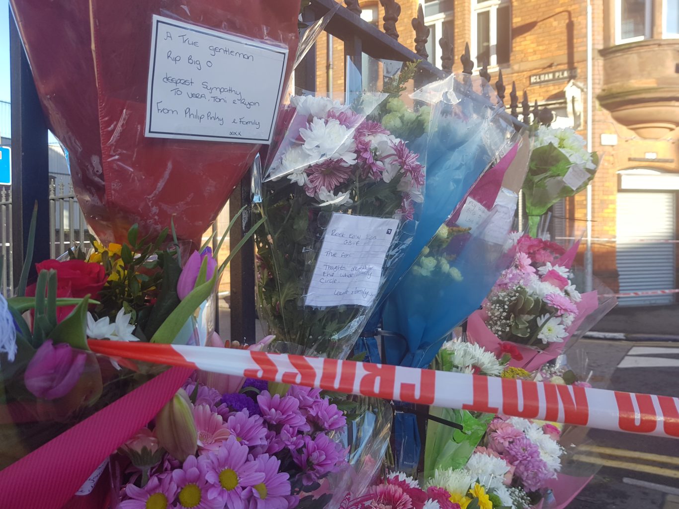 Floral tributes left on Belfast street where community worker was ...