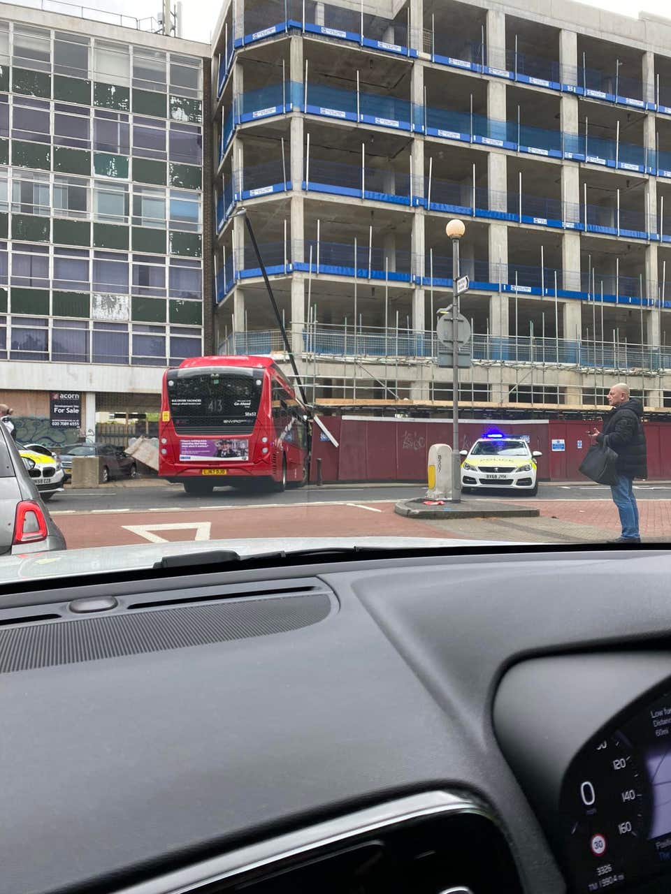 Front of bus smashed as it crashes into building in south London ...