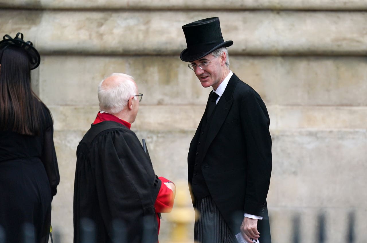 Top hats and caped detailing among garments worn by funeral guests ...
