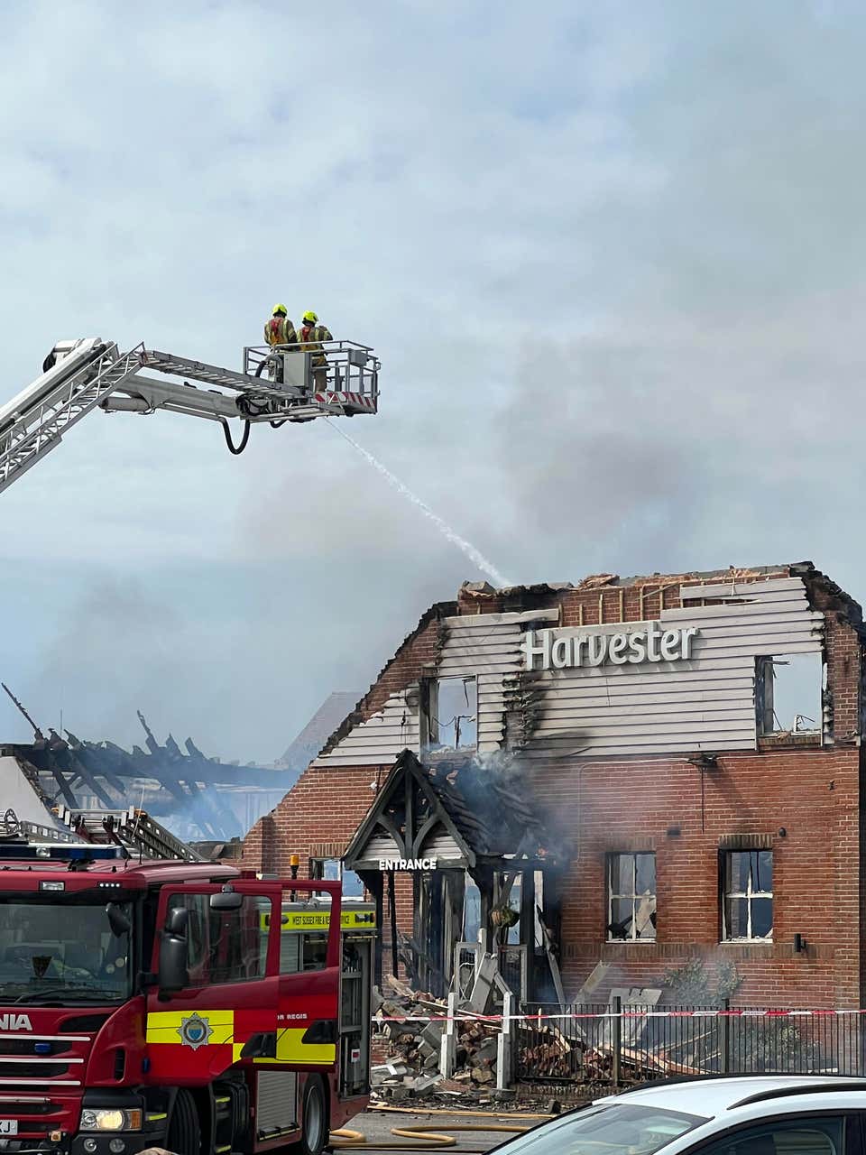 Plumes of smoke visible for miles from blaze at Harvester restaurant ...