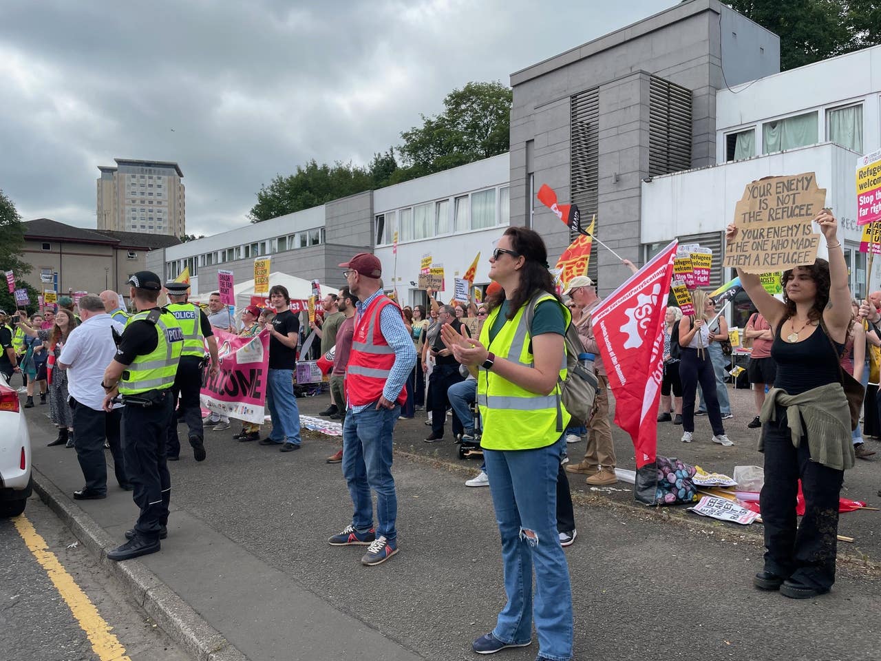 Anti-racism demonstrators stage counter-protest outside asylum seekers ...