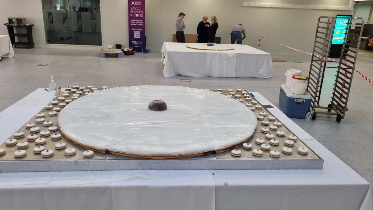 Sweet success! Bakers create largest-ever Empire biscuit to launch ...