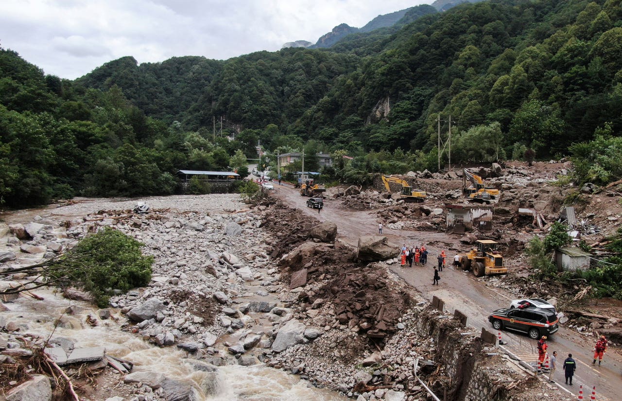 China residents evacuated from homes amid search for more mudslide ...