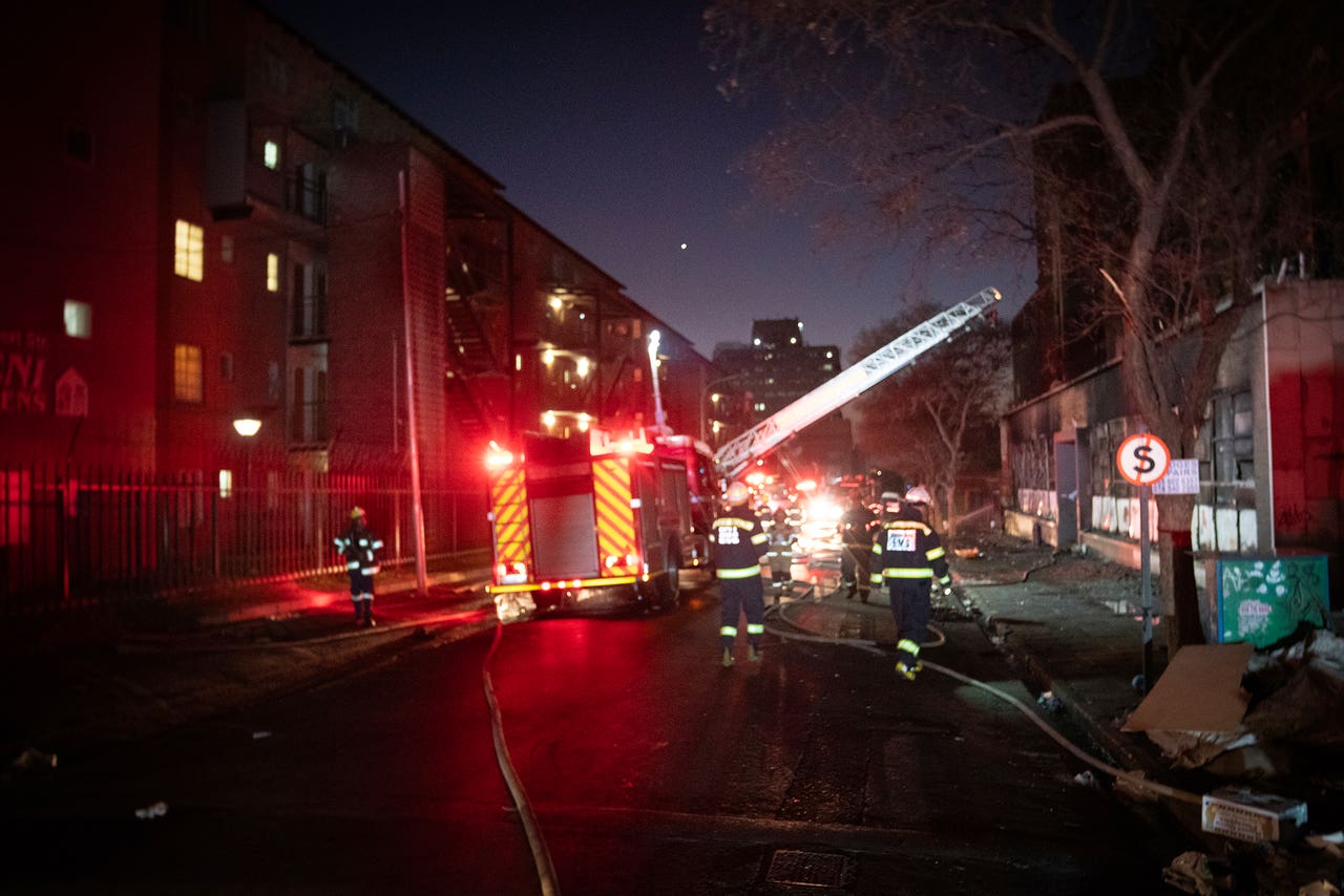 At least 74 dead as fire rips through rundown building in South Africa ...