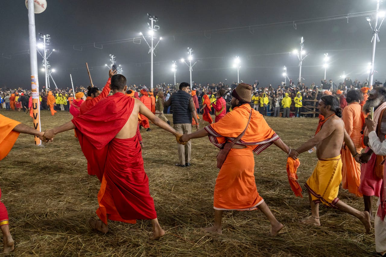 Hindu holy men and millions of pilgrims take dips in India’s largest ...