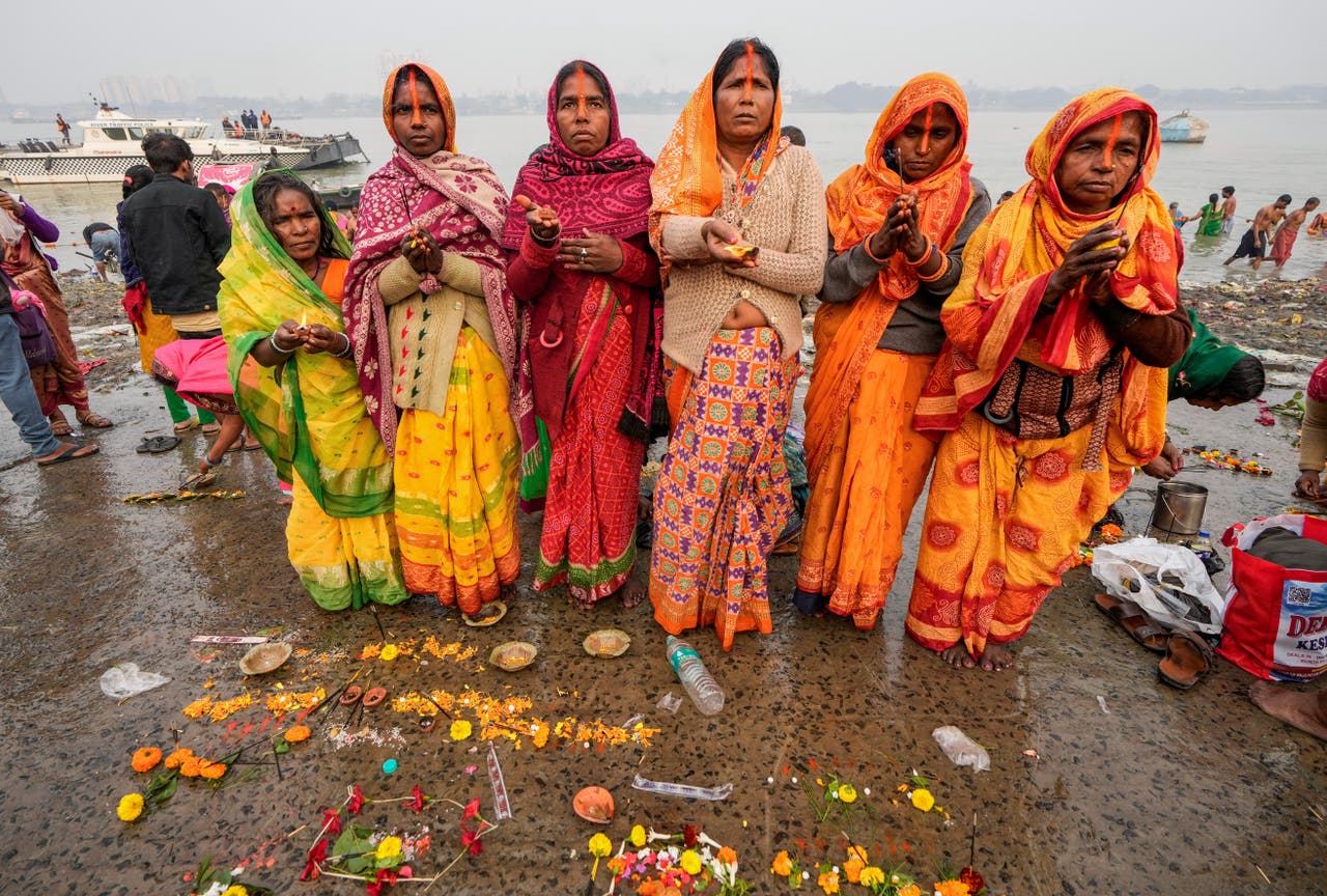 Hindu holy men and millions of pilgrims take dips in India’s largest ...