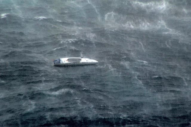 Australian Navy rescues rower as Pacific crossing hit by cyclone ...