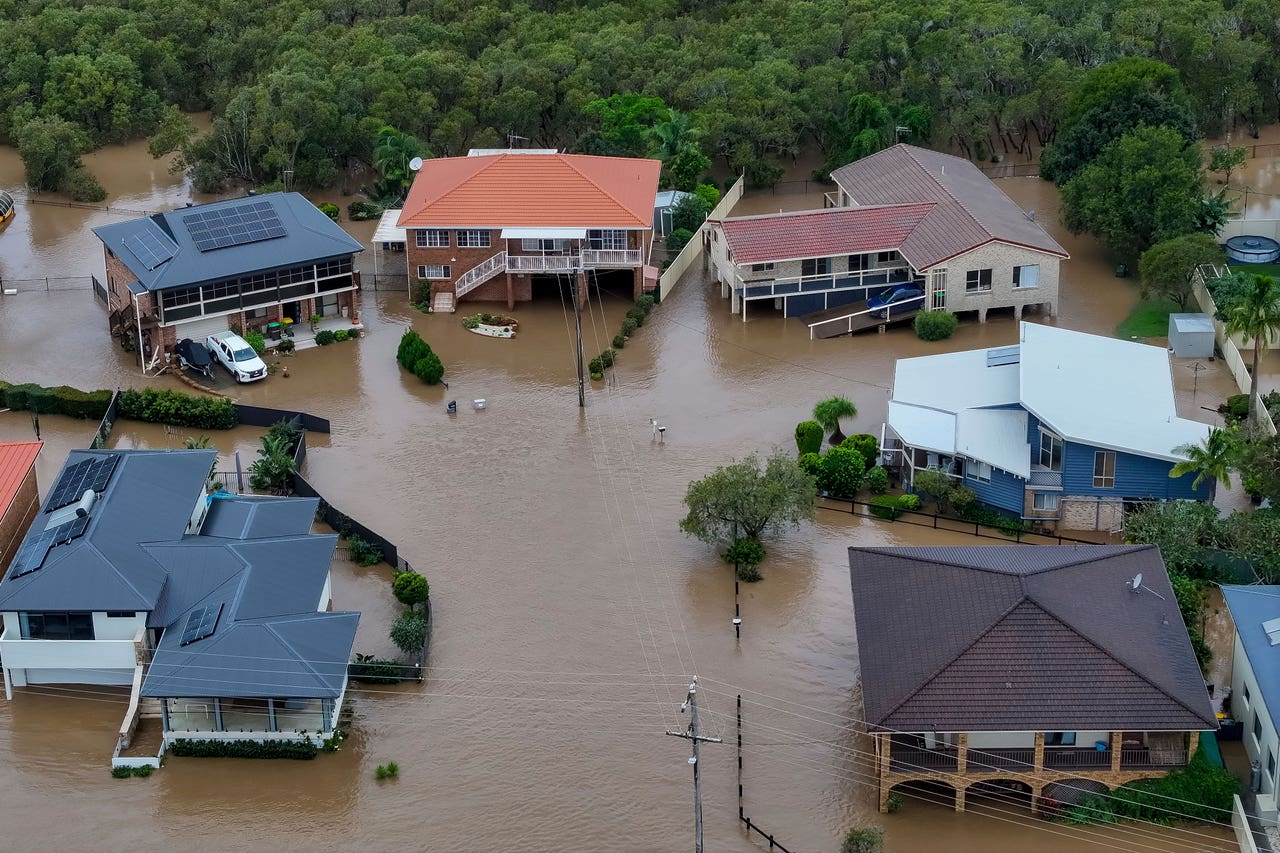 Record floodwaters in eastern Australia leave two dead and two missing ...