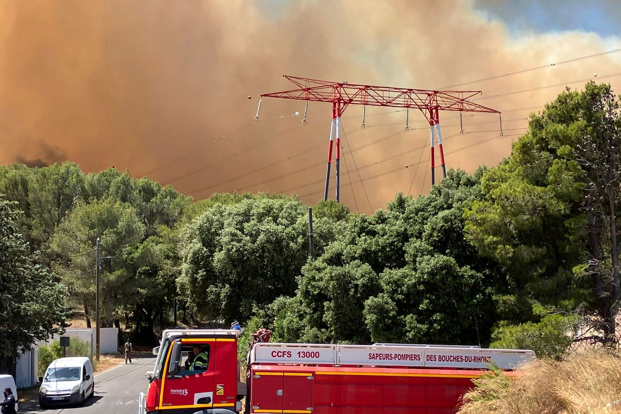 Flights suspended and stay-at-home orders issued after wildfire erupts ...