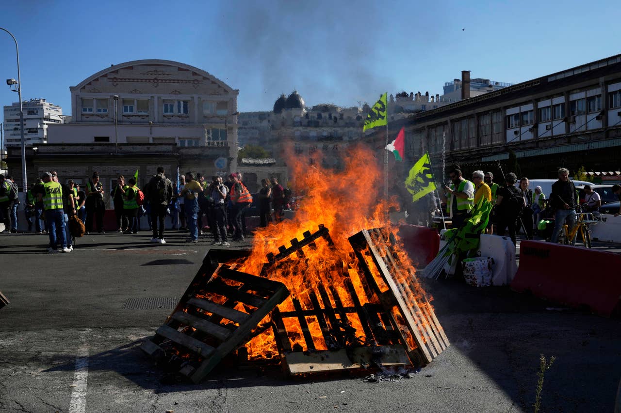 France hit by protests and strikes over Macron’s public service cuts ...
