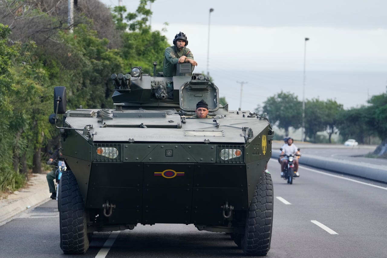 Tense calm holds in Venezuela a day after Maduro deposed | The Herald