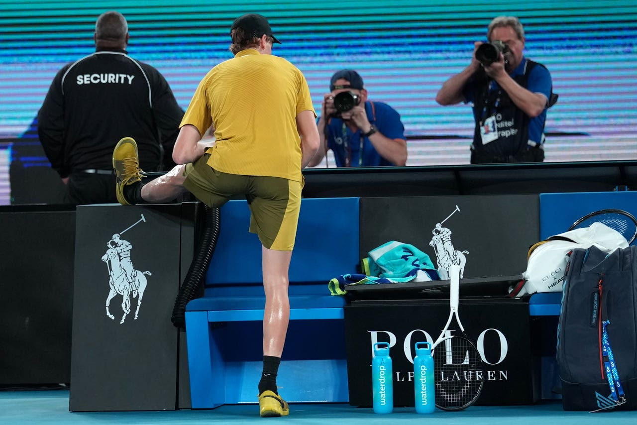 Jannik Sinner battles through sweltering conditions to reach fourth ...