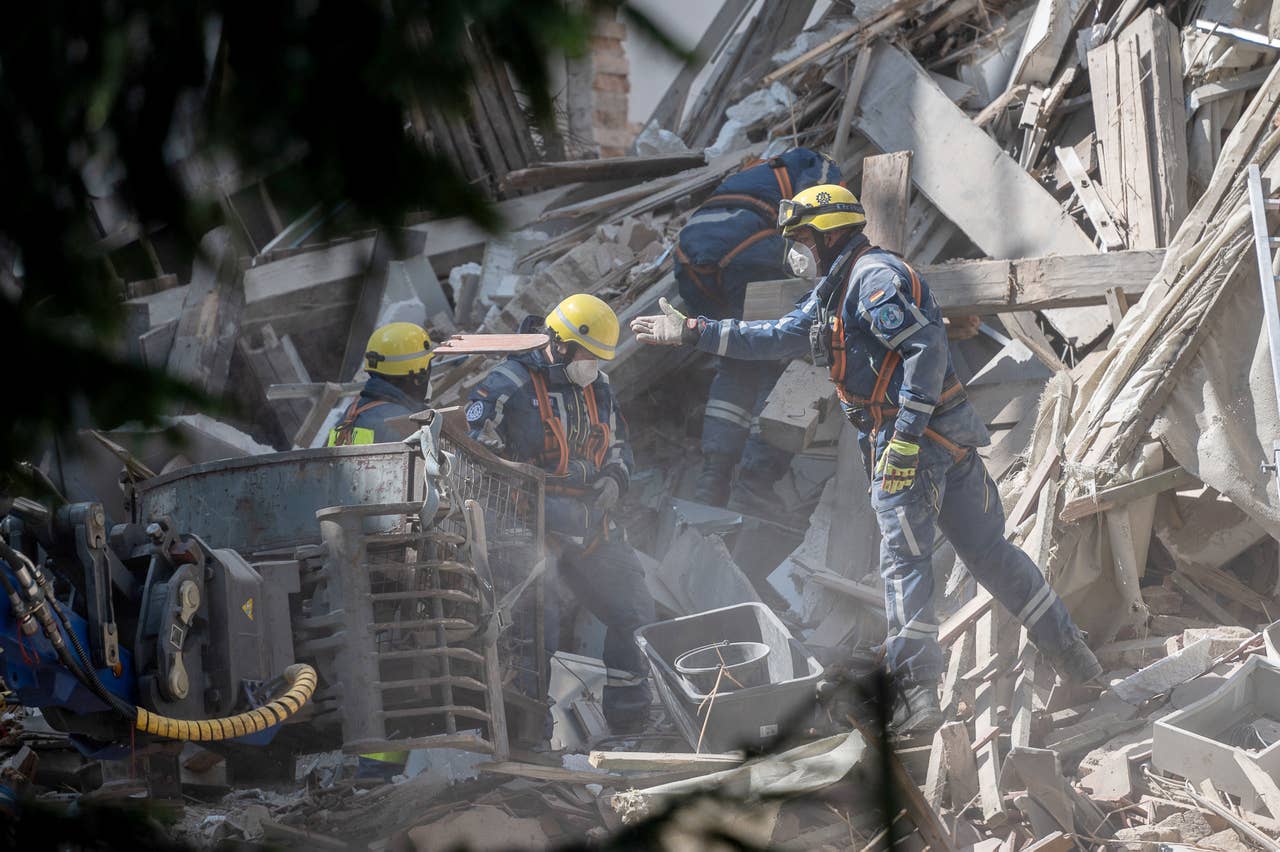 Rescuers search for three people missing after German building collapse ...