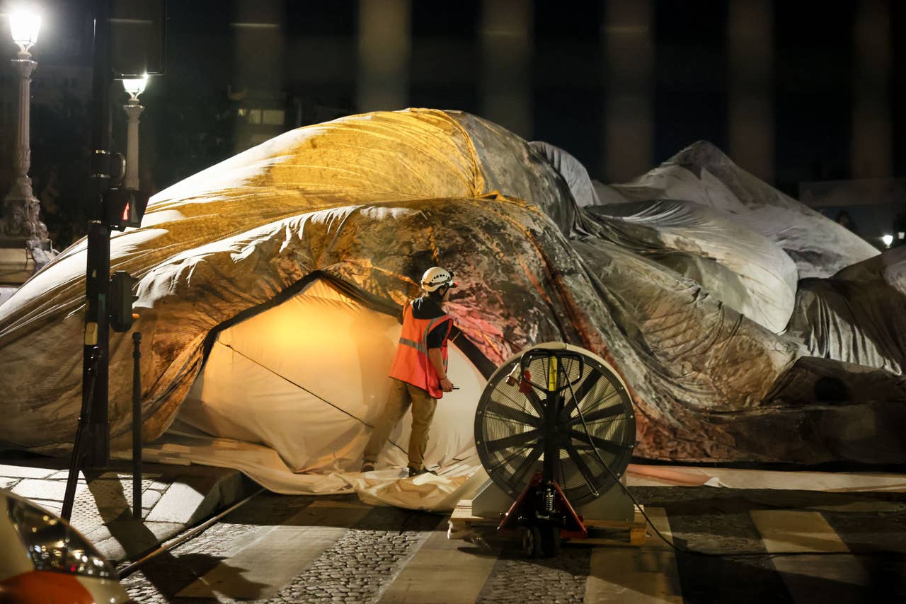 French artist JR begins his giant ‘cave’ art inflation over Paris ...