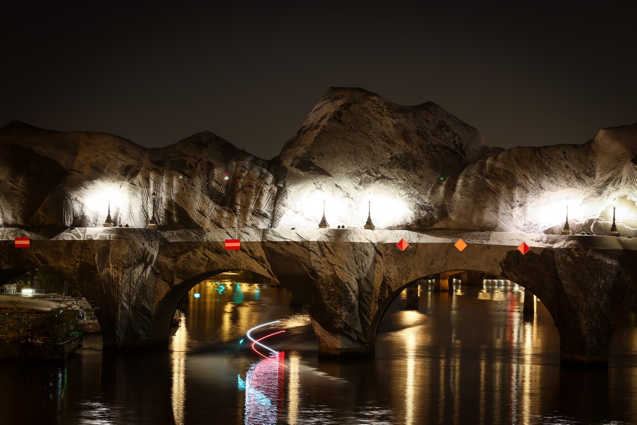 French artist JR begins his giant ‘cave’ art inflation over Paris ...
