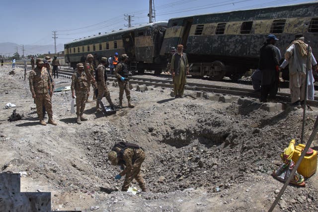 More than a dozen killed in suicide blast targeting train in Pakistan