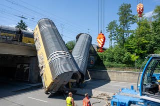 One dead as freight train goods wagons plunge off bridge | Herald Series