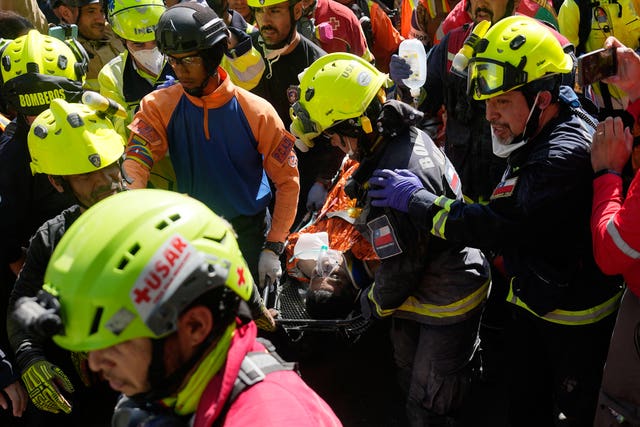 Venezuelan security guard pulled alive from building eight days after ...